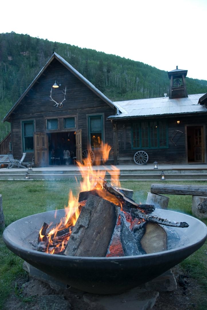 Reception Décor Photos - Rustic Wedding Fire Pit - Inside Weddings