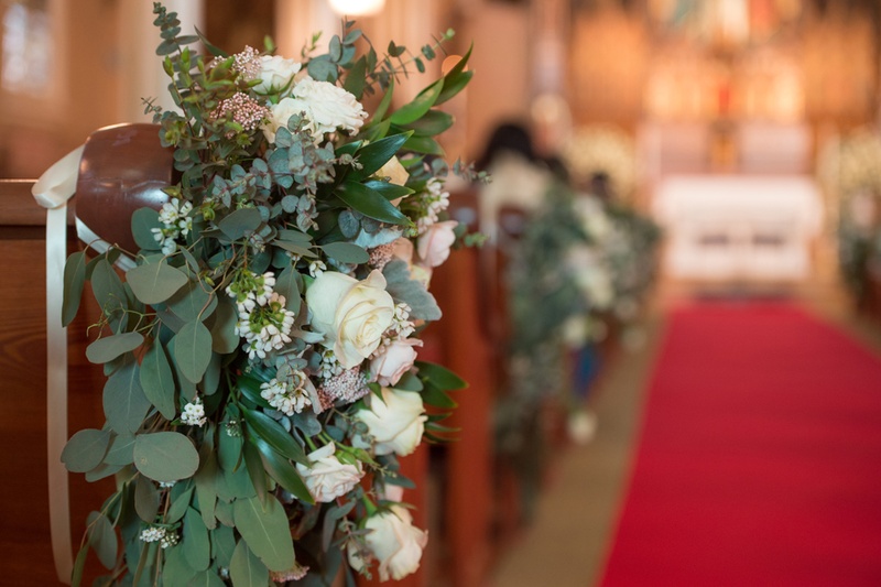 Ceremony Décor Photos - Greenery on Ceremony Pews - Inside Weddings