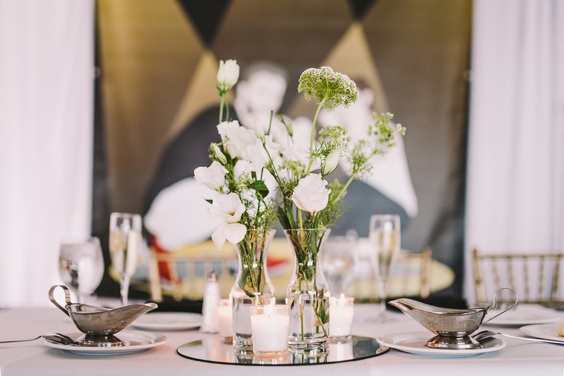 Reception Décor Photos - Bud Vases on Mirror - Inside Weddings